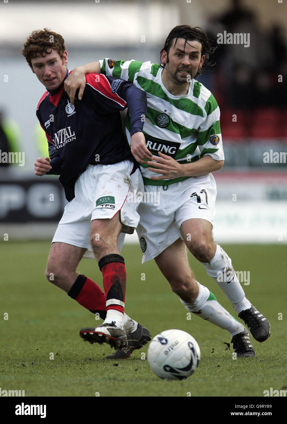 Falkirk's Patrick Cregg (left) holds off the challenge from Celtic's ...