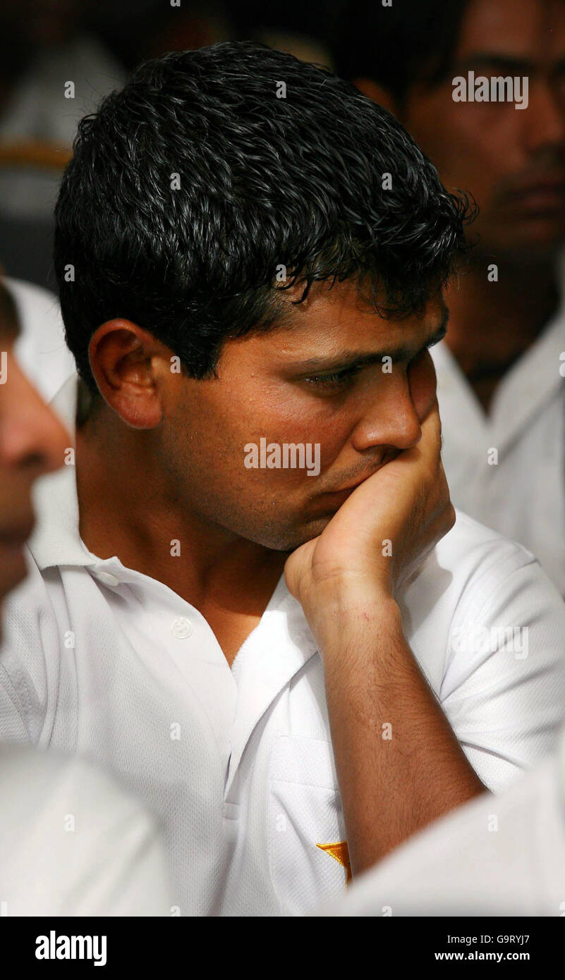 Pakistan's Kamran Akmal listens as Inzamam-ul-Haq announces his ...