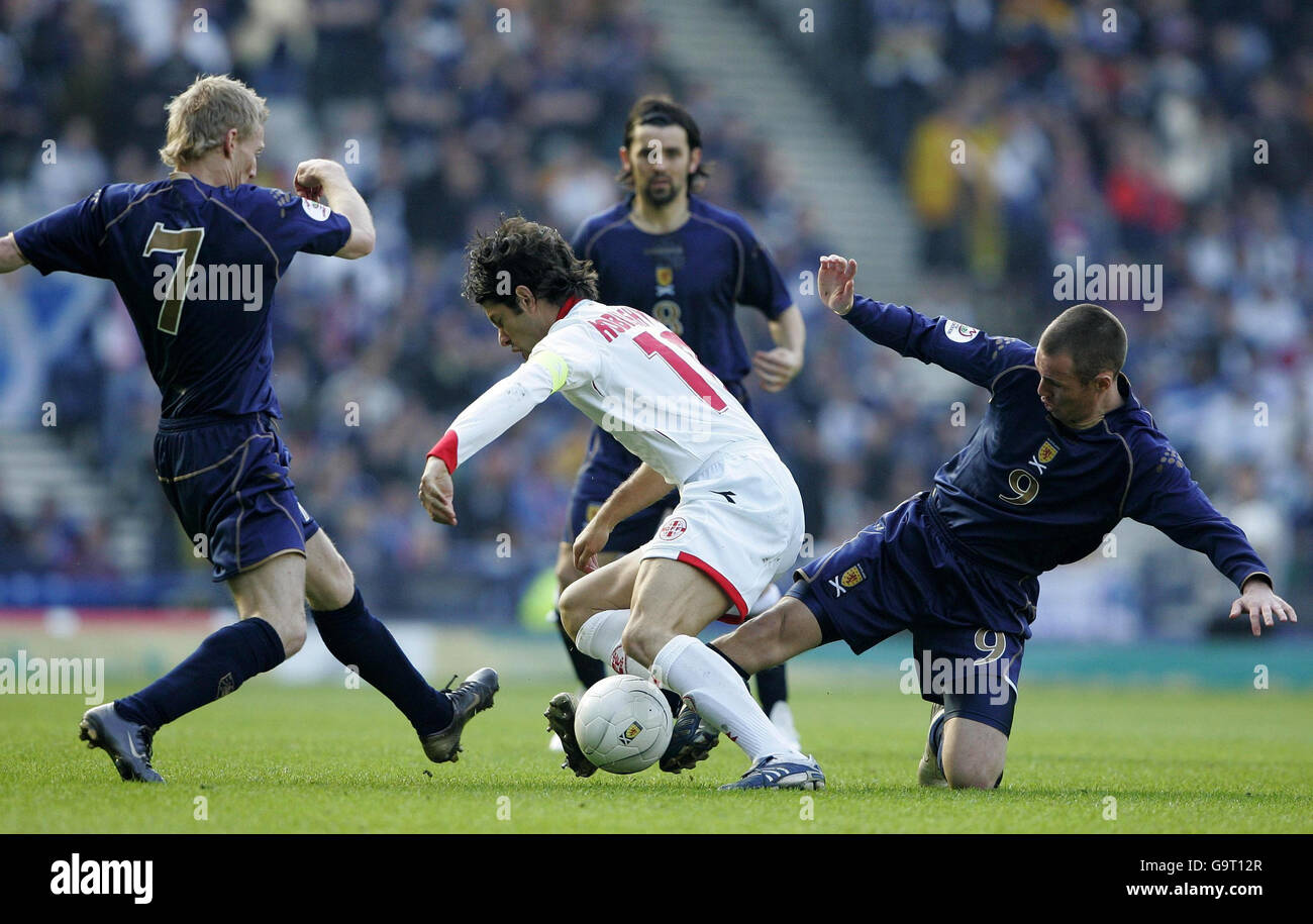 Scotland's Kenny Miller challenges Georgia's Levan Kobiashvili during ...