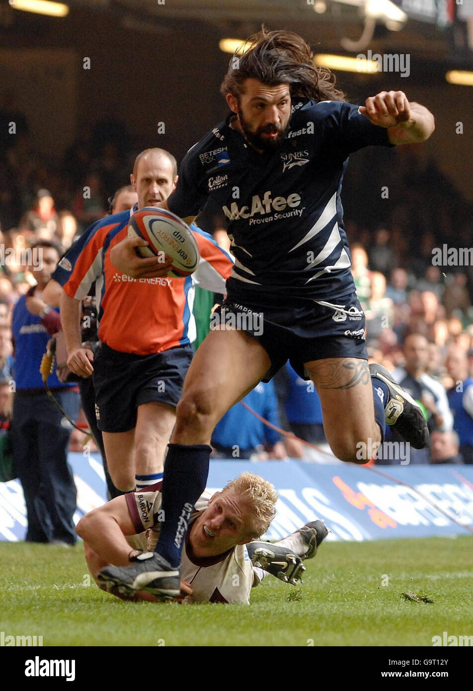 Sale Sharks' Sebastian Chabal drives through the tackle of Leicester ...
