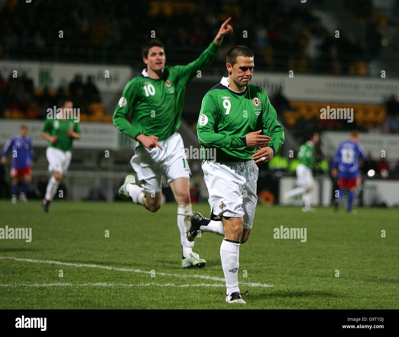 Northern Ireland's David Healy celebrates his goal with Kyle Lafferty ...