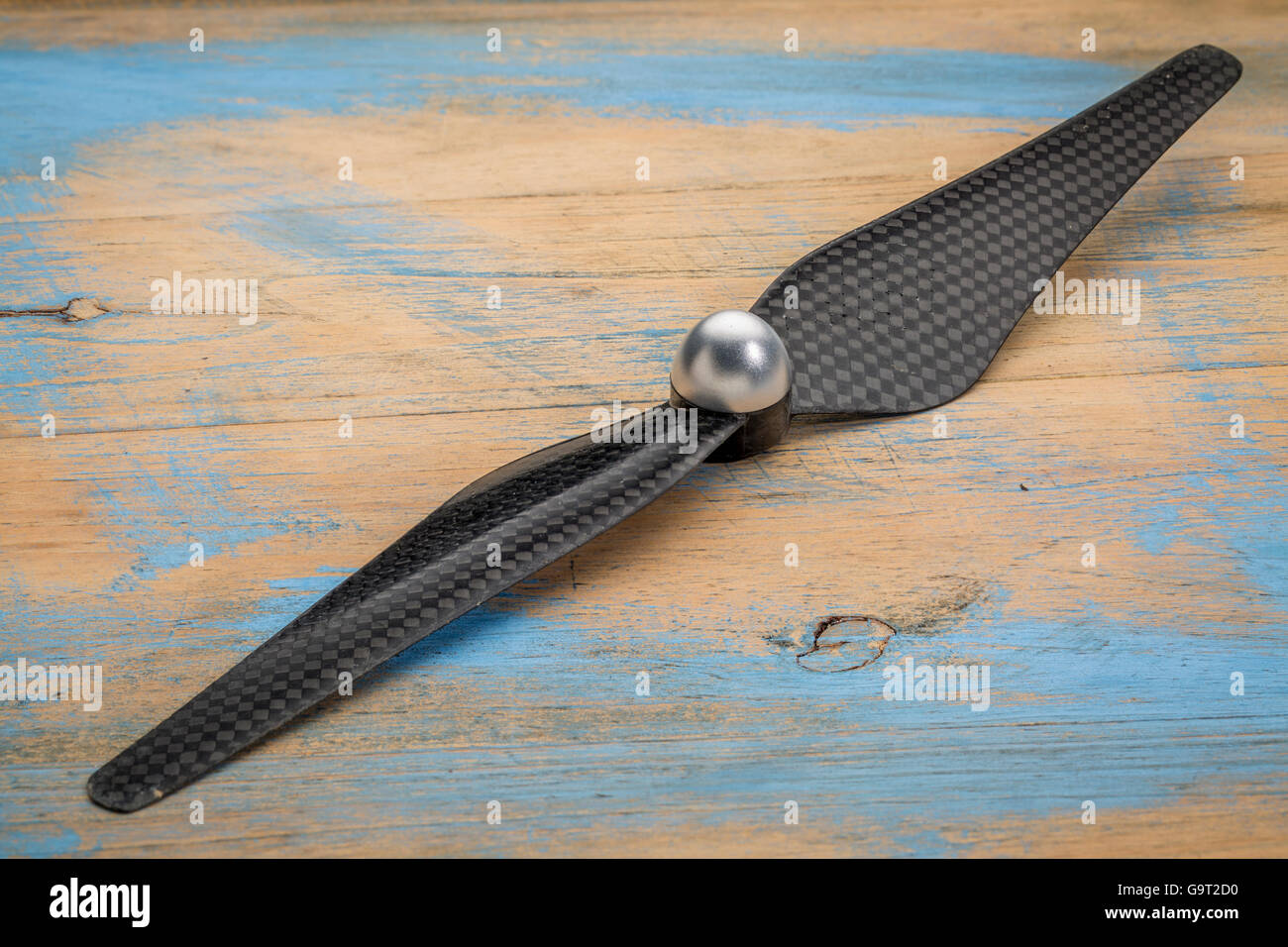 carbon fiber drone propeller against grunge wood Stock Photo - Alamy