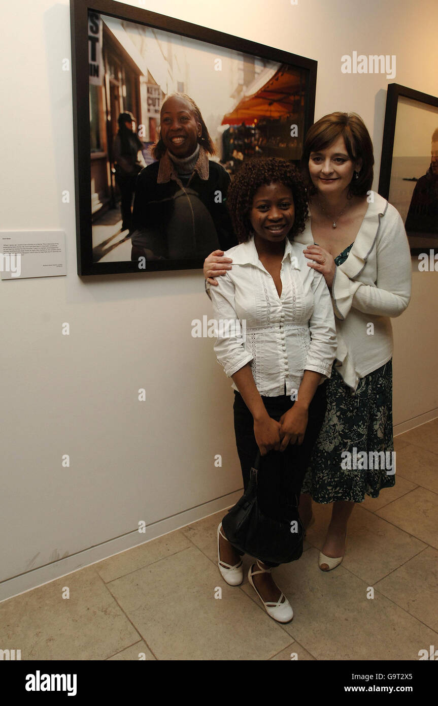 Cherie Booth stands next to Kemi Banjo and her portrait, at the 'When I ...