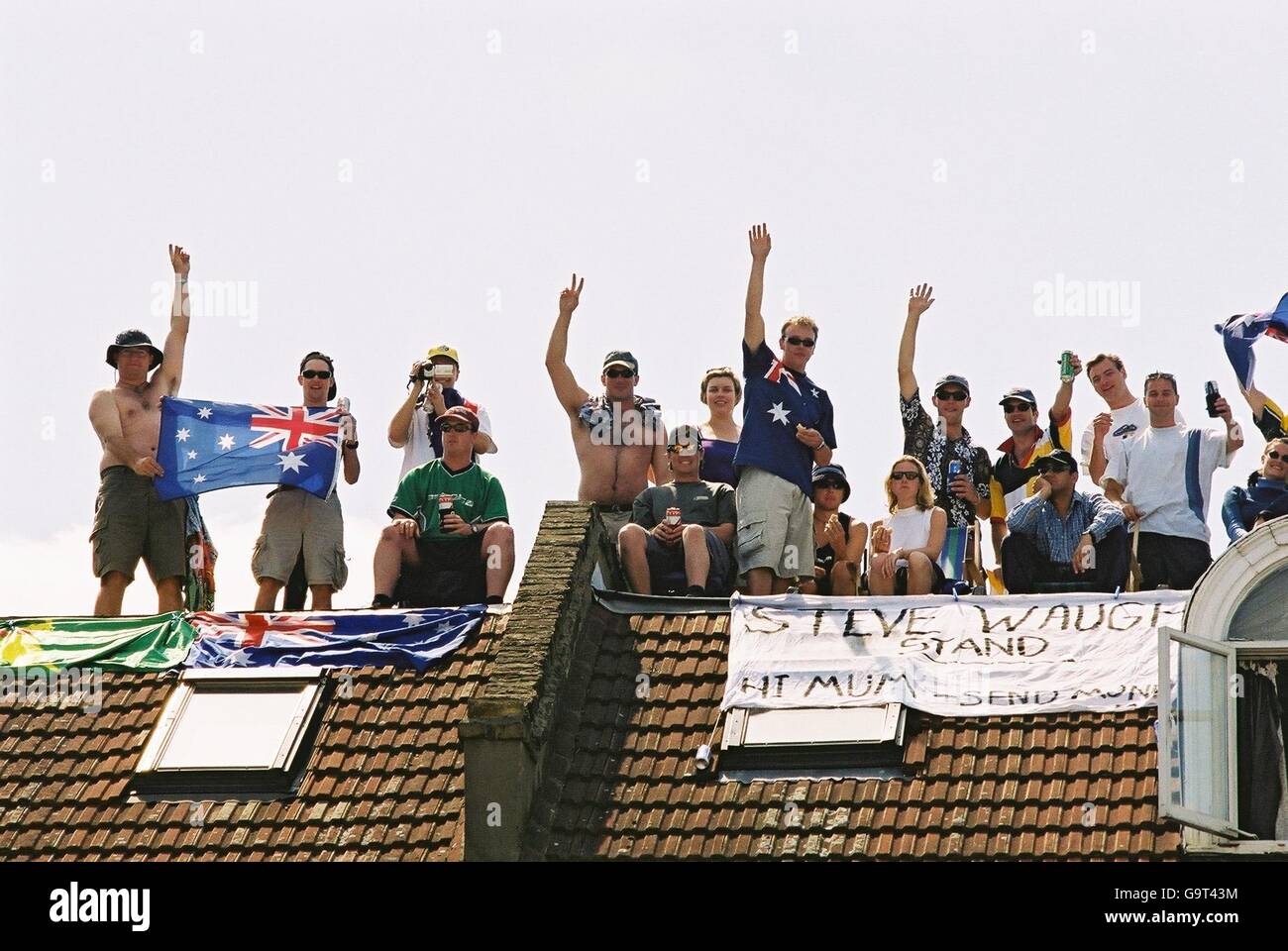Australia fans cheer on their team from a roof overlooking the Oval ...