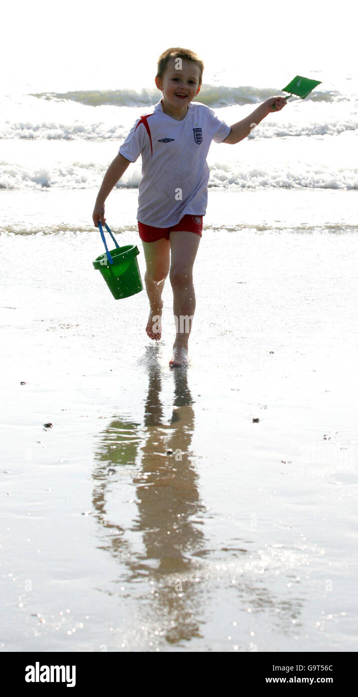 Charlie Gardner, 6, from Leicester collects water for a sandcastle on ...
