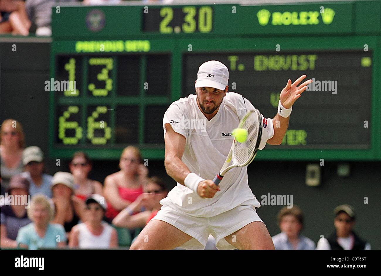 Pat Rafter in action against Sweden's Thomas Enqvist and progressing to ...