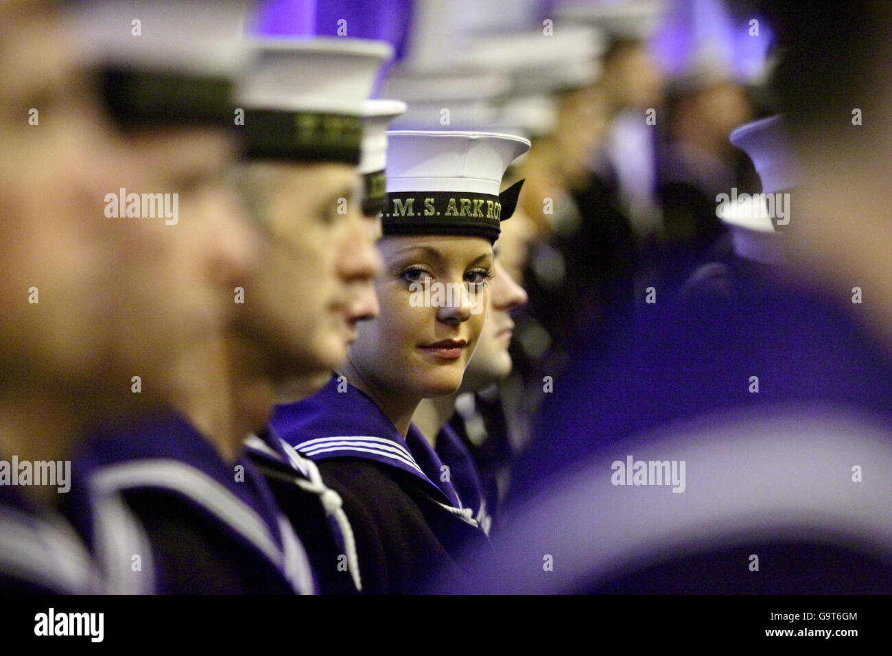 A Junior Rating looks along the line during the rededication service ...