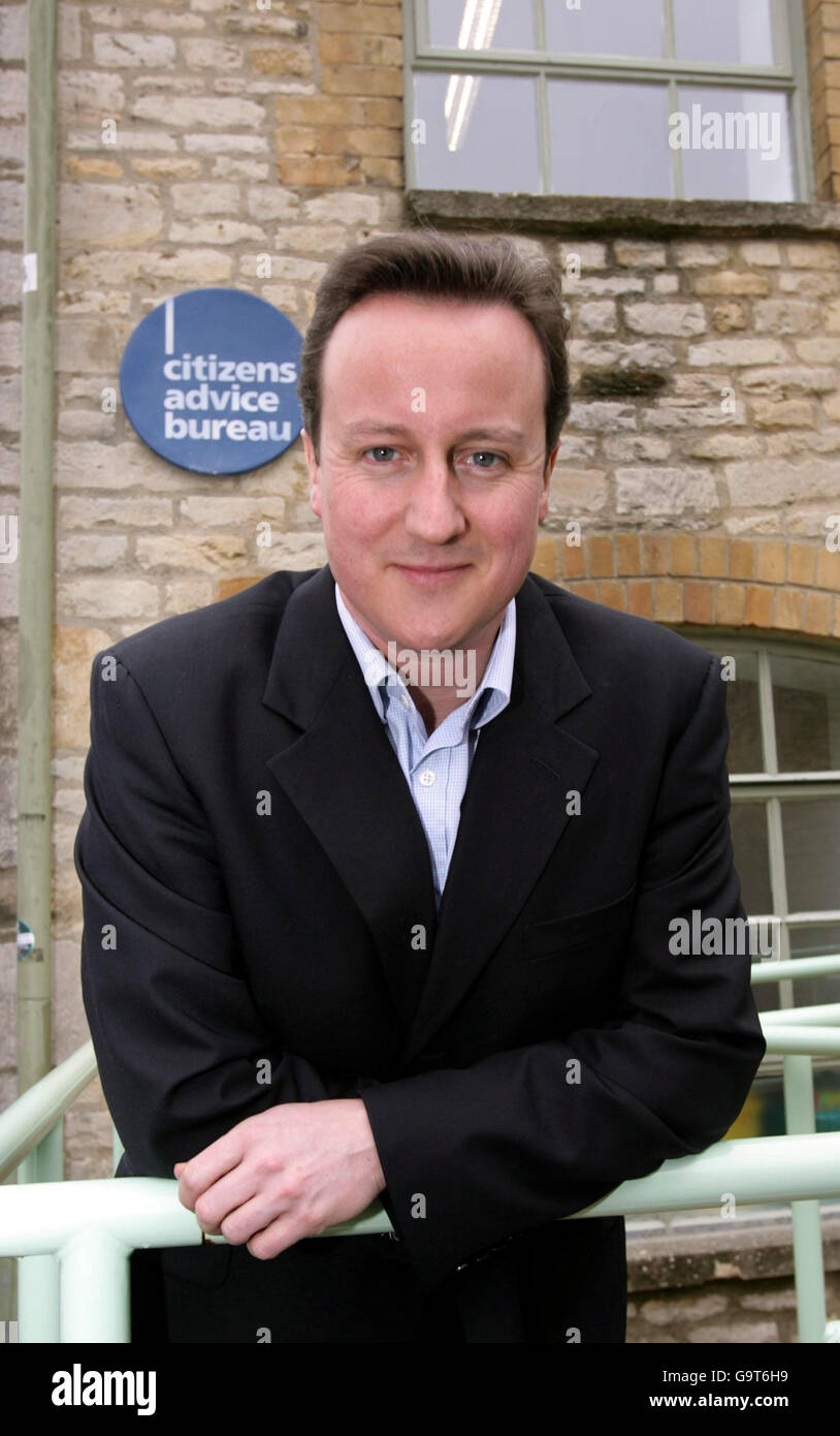 Conservative leader David Cameron poses for the media after opening a ...