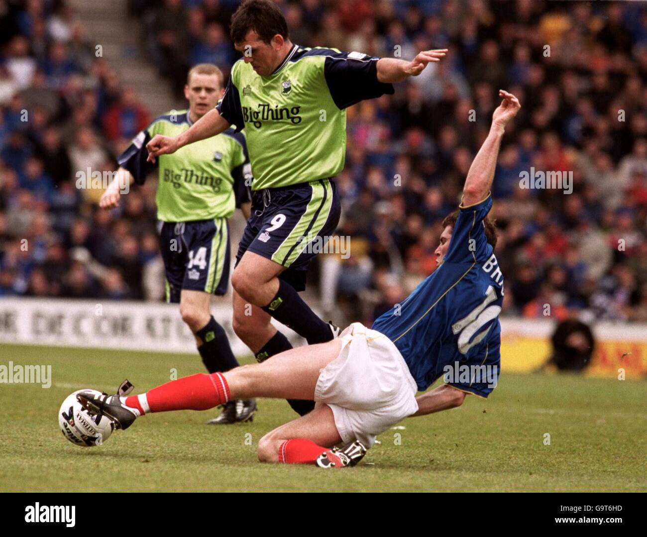 Portsmouth's Lee Bradbury (r) tackles Barnsley's Neil Shipperley (l ...