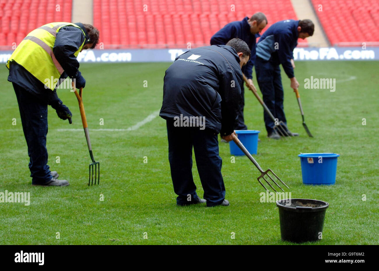 Wembley Ground Staff working on the pitch during a training session at ...