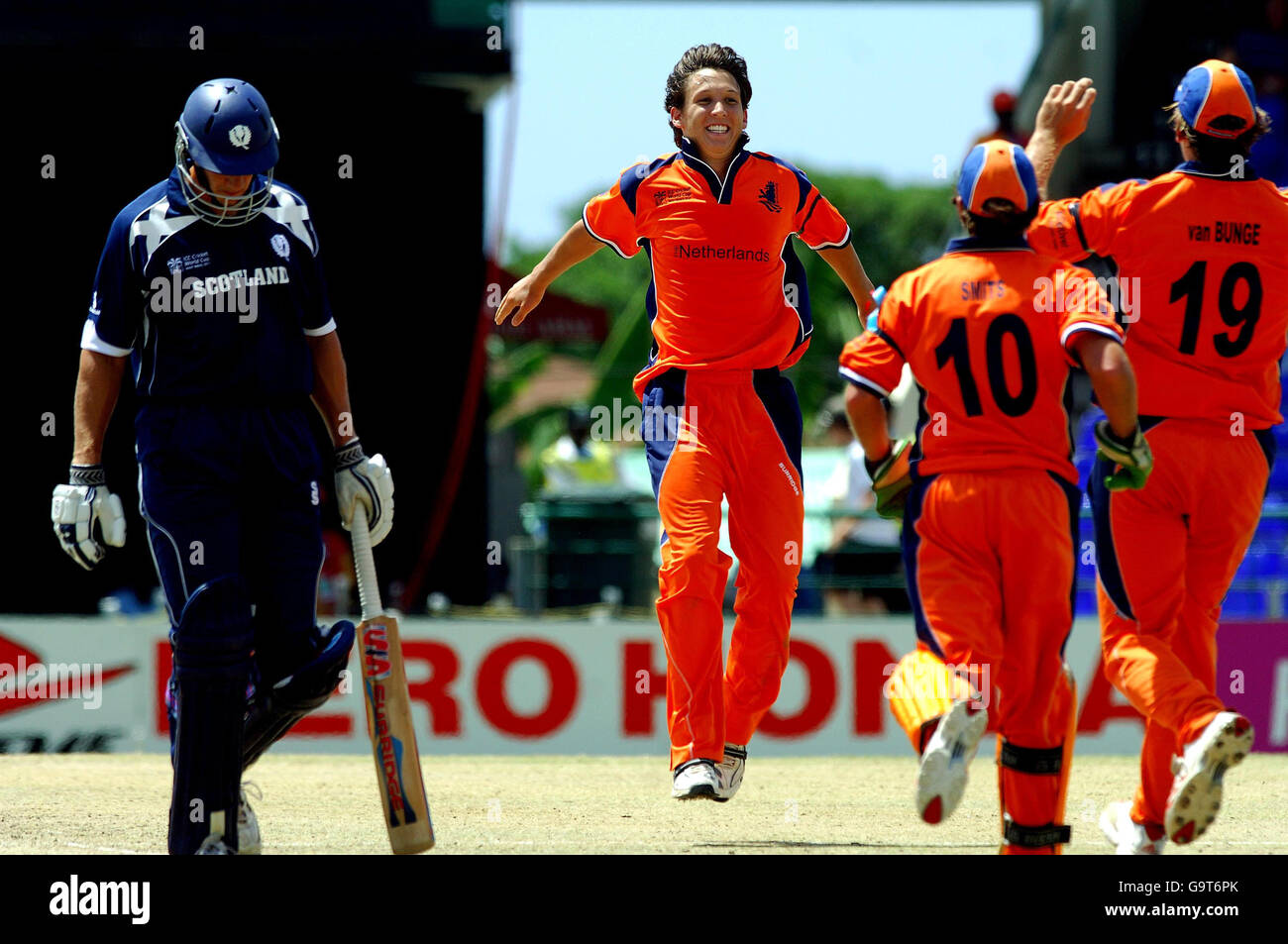 Scotland's Colin Smith (left) bowled by Netherlands Mark Jonkman ...