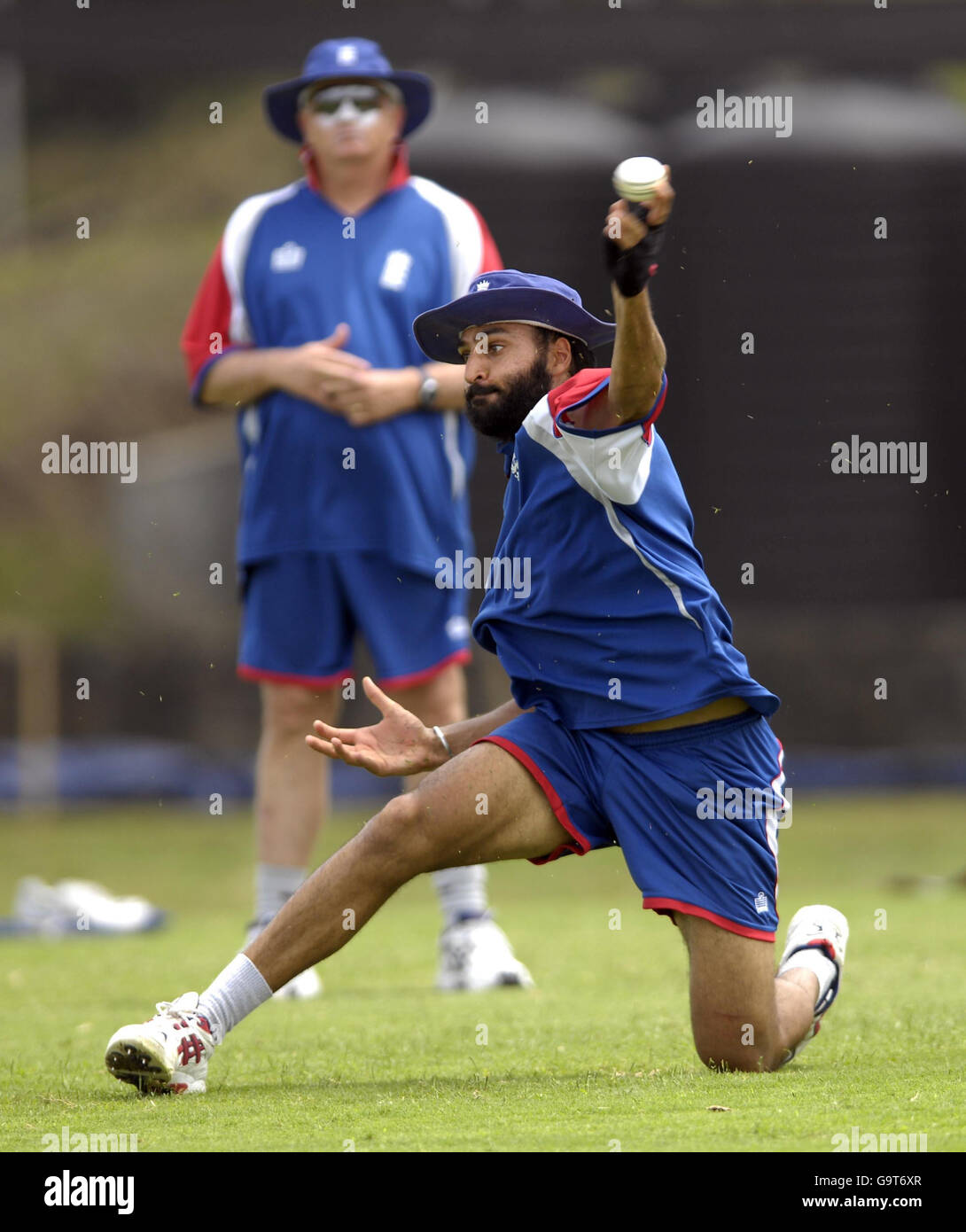 England coach Duncan Fletcher (left) watches as Monty Panesar takes part in fielding practice ...