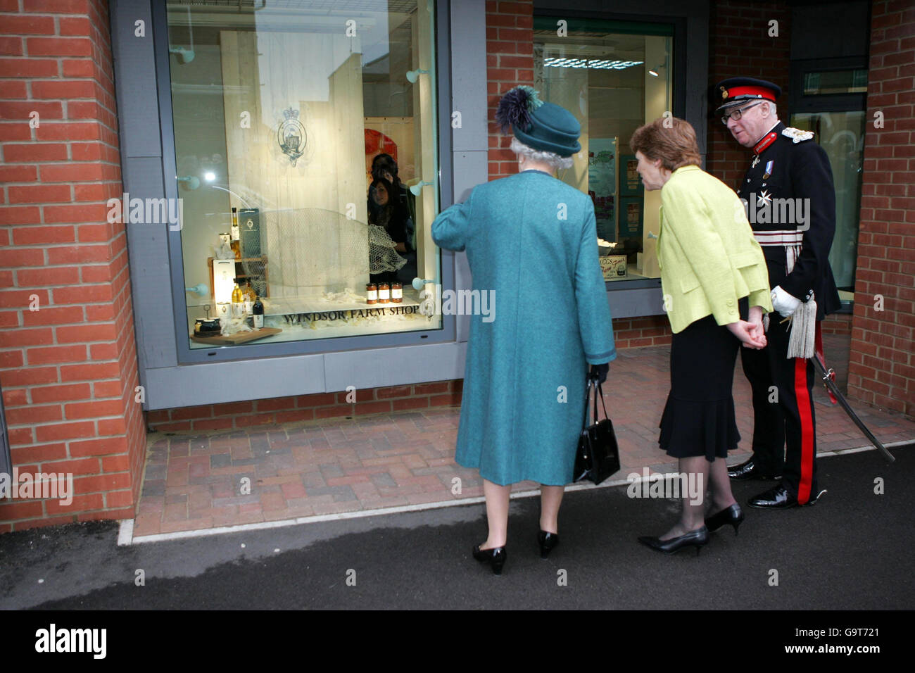 Britain's Queen Elizabeth II looks at 'window displays' which are part ...