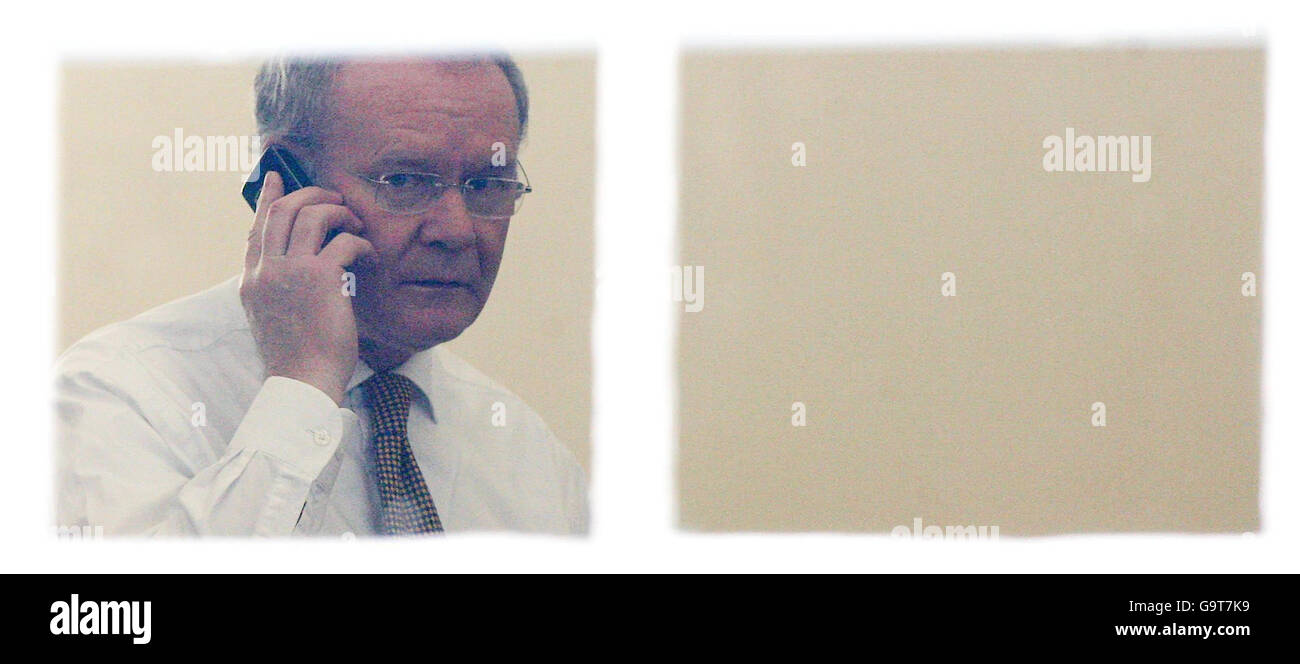 Sinn Fein Deputy Leader Martin McGuinness speaks on the telephone in ...
