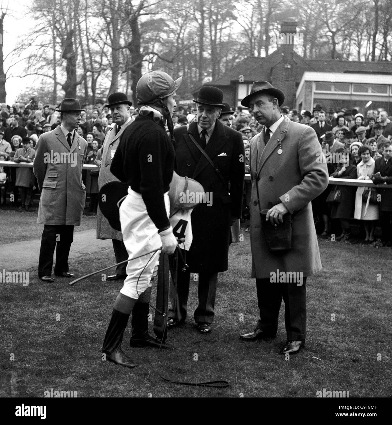 Owner Jim Joel (c) chats to jockey J King (l) and trainer R Turrell (r ...