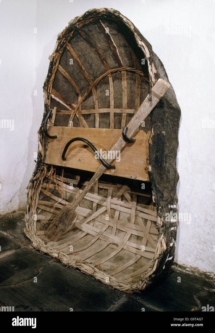 A coracle & paddle in the porch of St David's Church, Manordeifi, close ...
