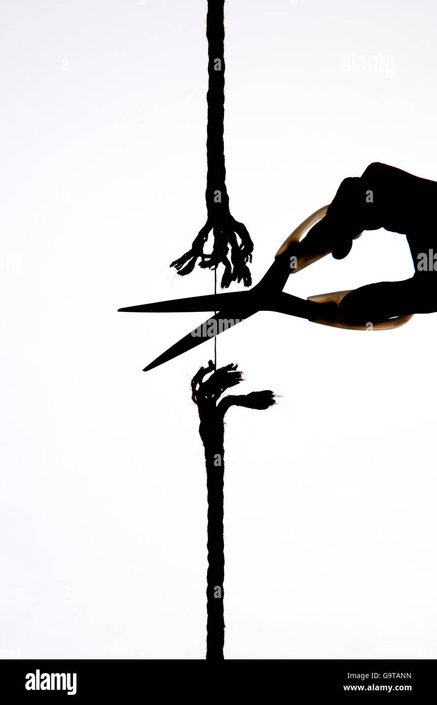 Scissor cutting string hi-res stock photography and images - Alamy