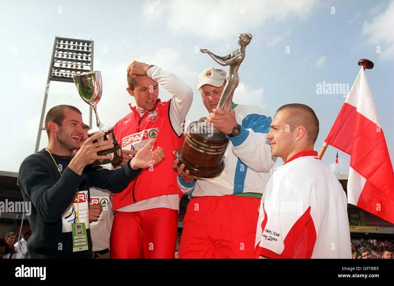 Members of the triumphant Poland men's team celebrate with the trophies ...