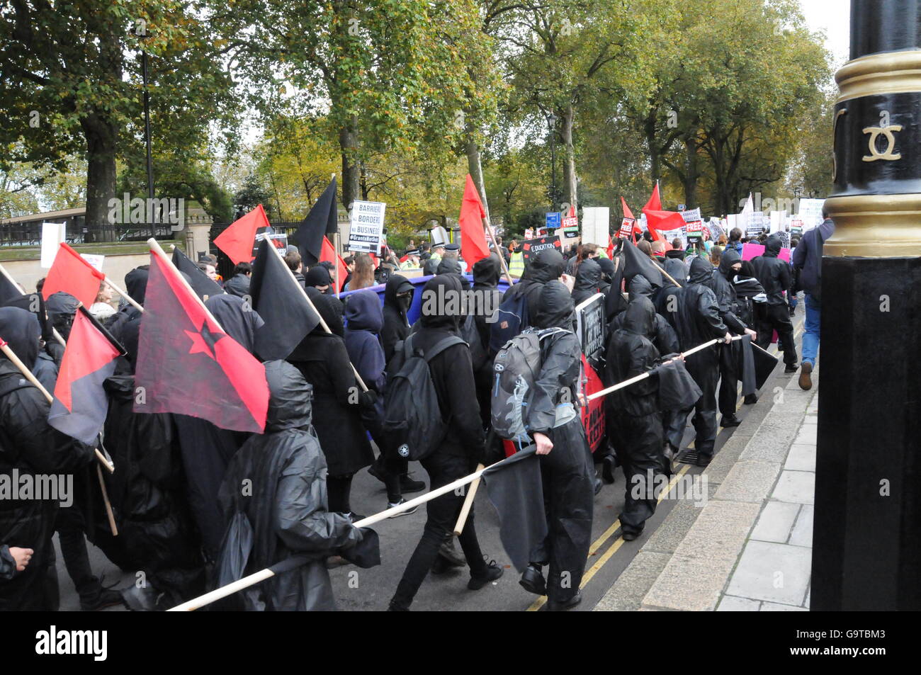 Anarchist group Black Block, march in support of students facing cuts ...