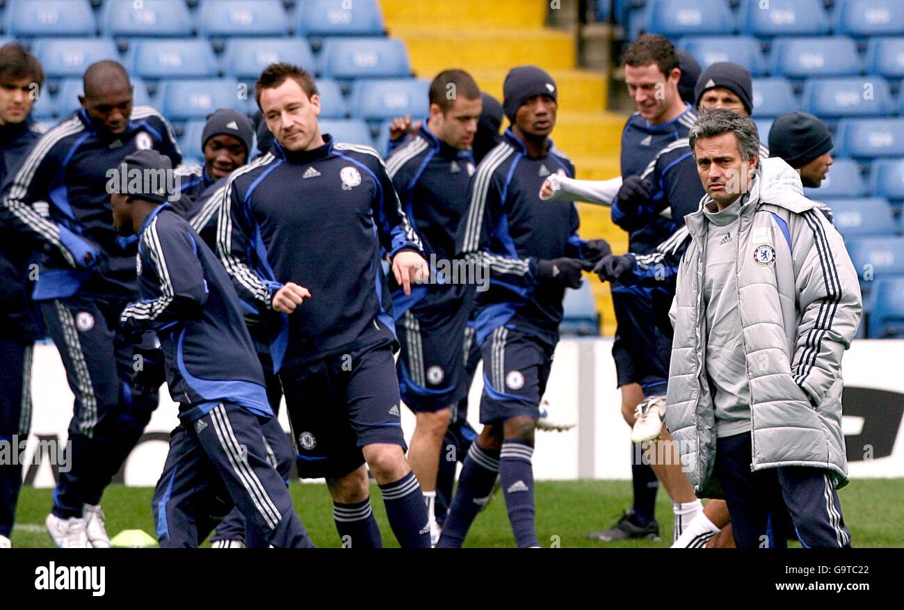 Chelsea manager Jose Mourinho (right) oversees his teams training ...