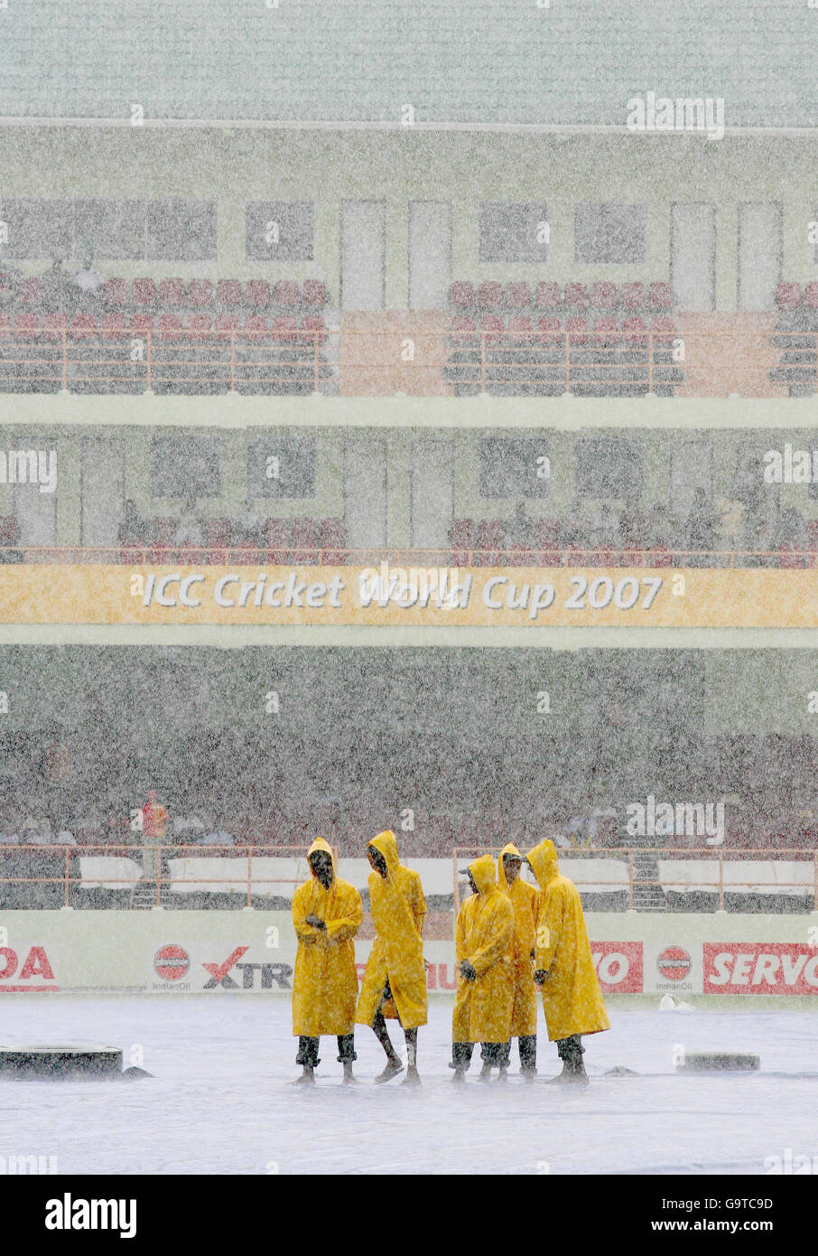 Groundstaff on the wicket as rain stops play during the ICC Cricket ...
