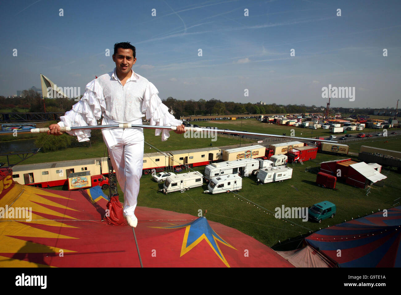 Circus artist Henry Ayala from the Los Ayalas troupe walks the hire ...