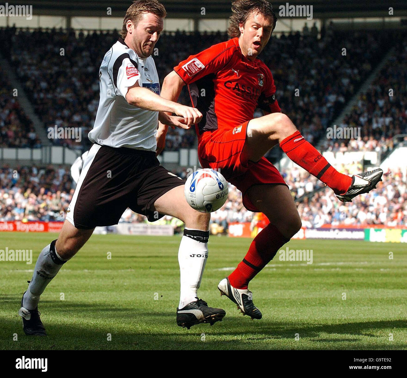 Derby's Steve Howard (left) and Coventry's Elliott Ward during the Coca ...