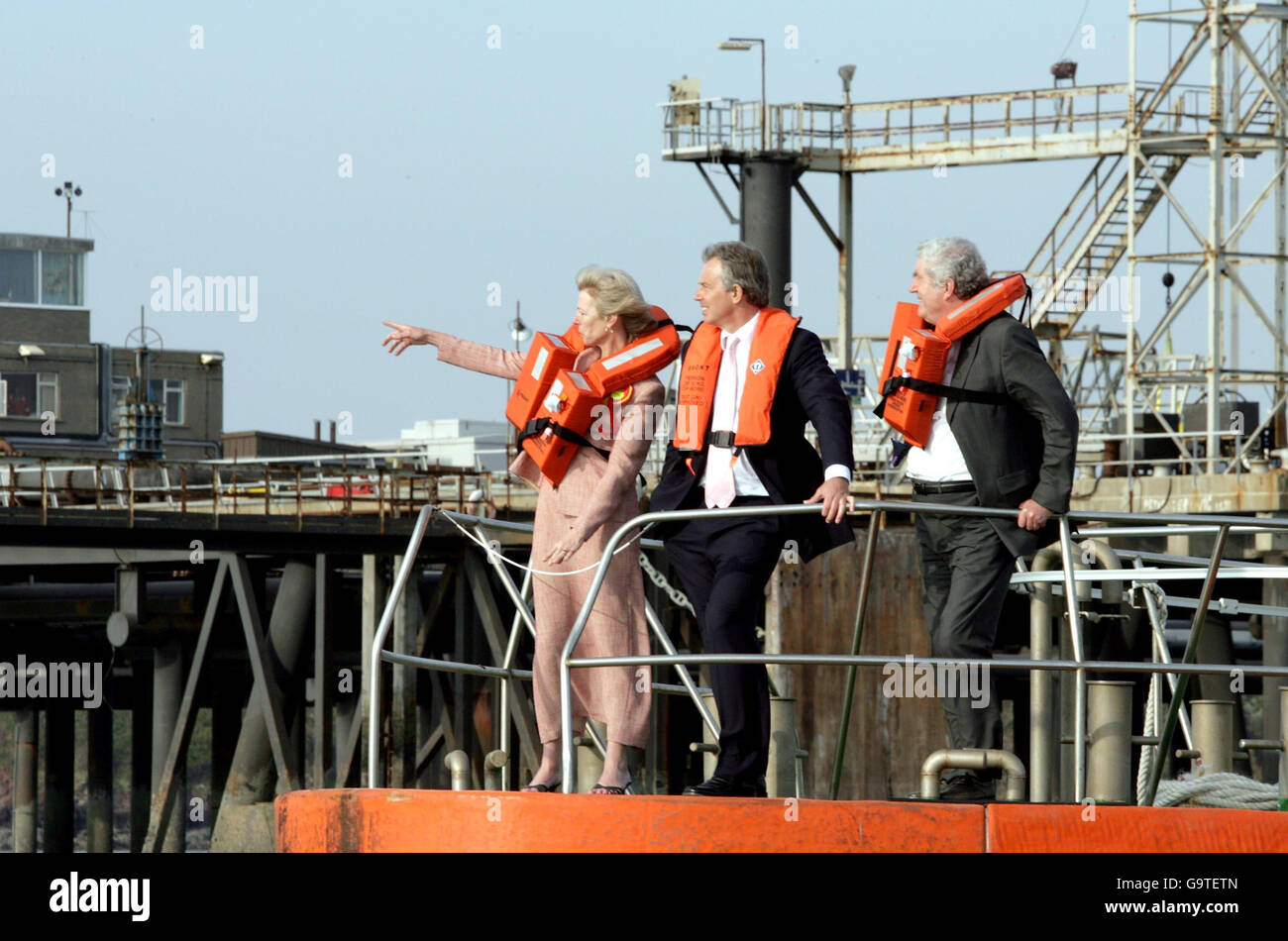 Britain's Prime Minister Tony Blair (centre) takes a boat trip with ...