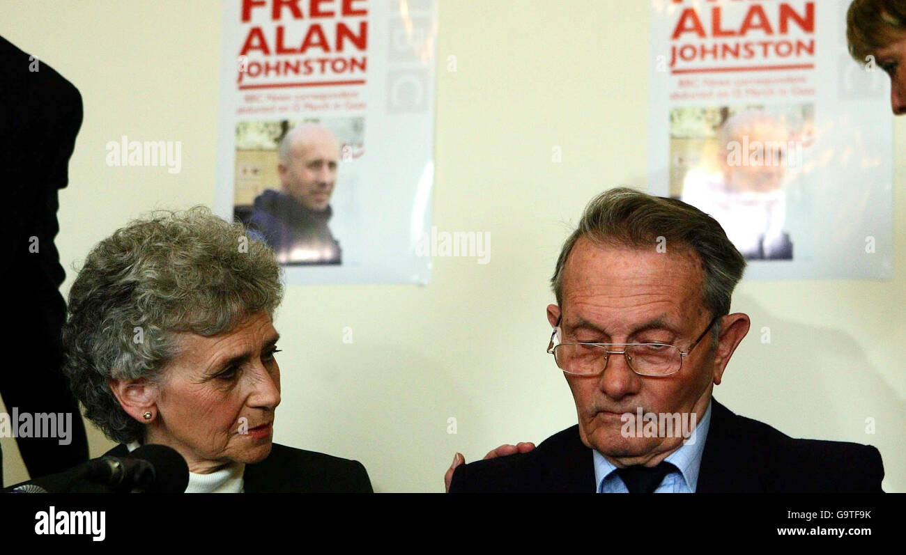 Graham Johnston, father of kidnapped journalist Alan is comforted by ...