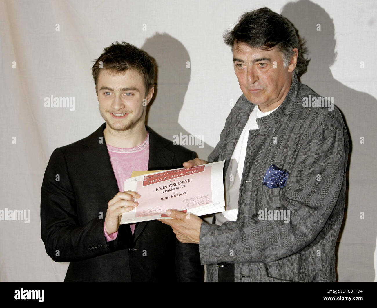 Daniel Radcliffe and Bill Bryden present a cheque on behalf of the ...