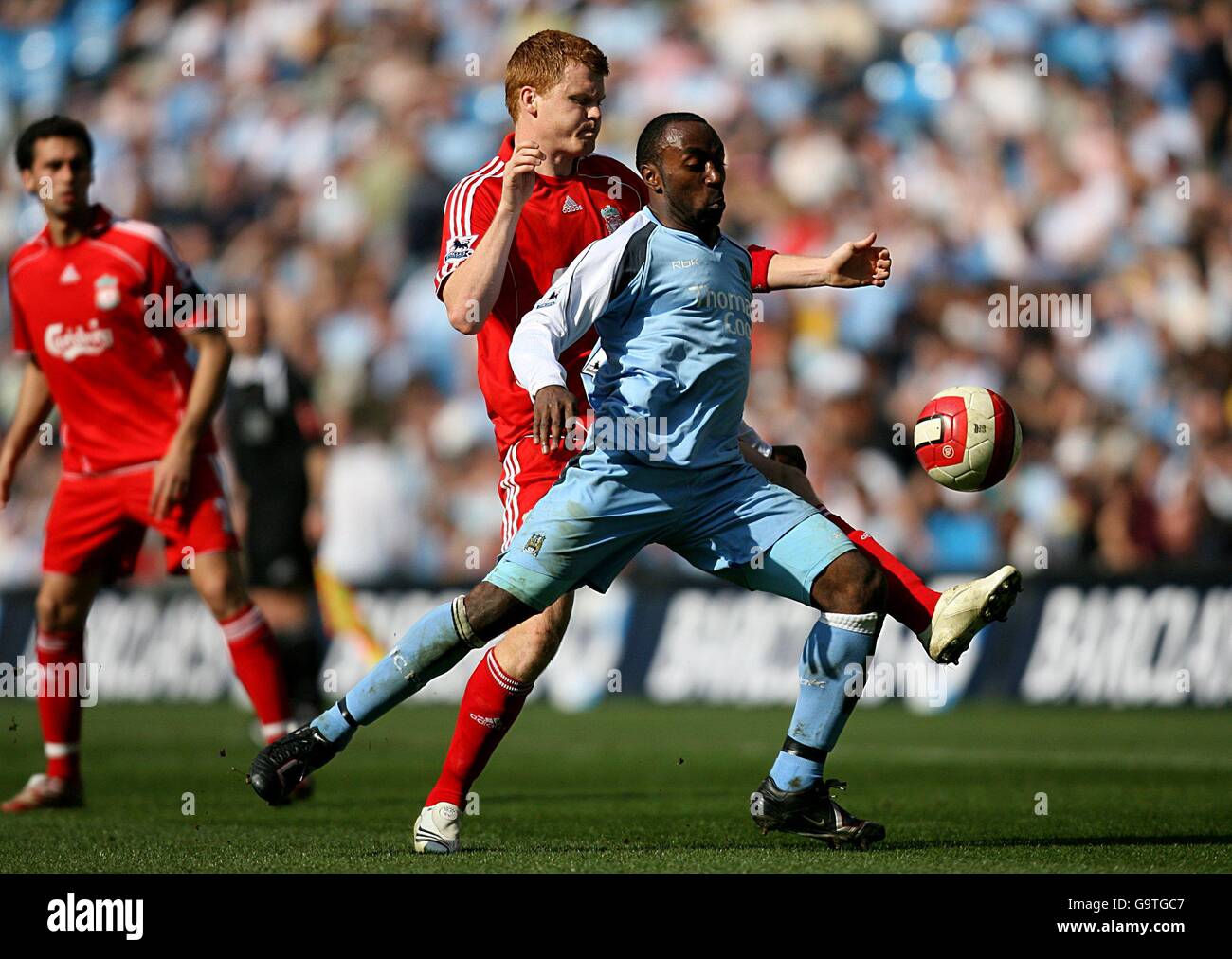 Liverpool's John Arne Riise and Manchester City's Darius Vassell battle ...