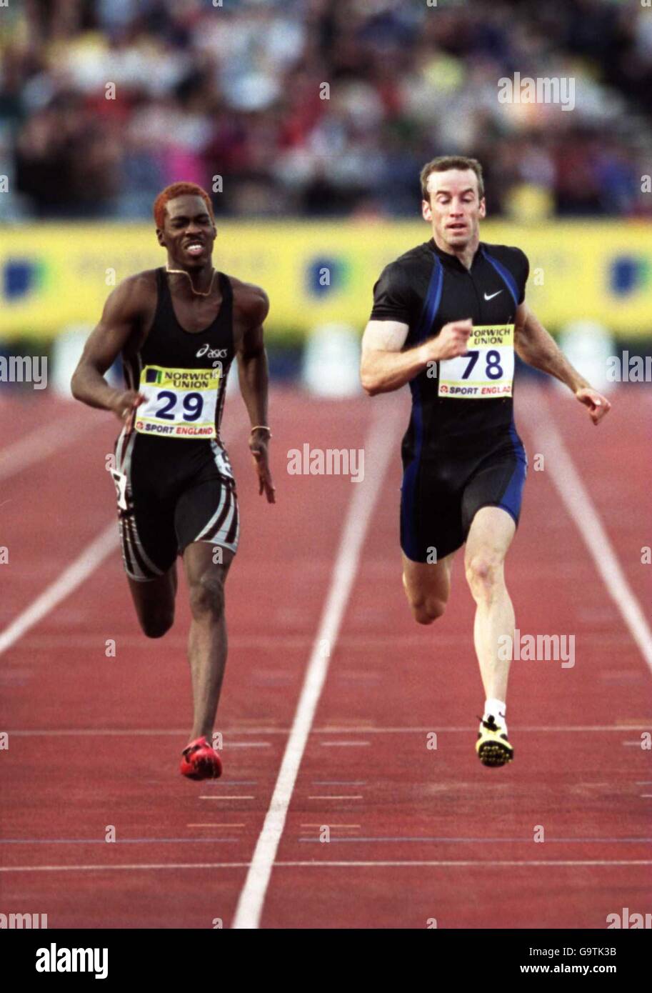 (L-R) Christian Malcolm and Kevin Little fight it out for second place ...