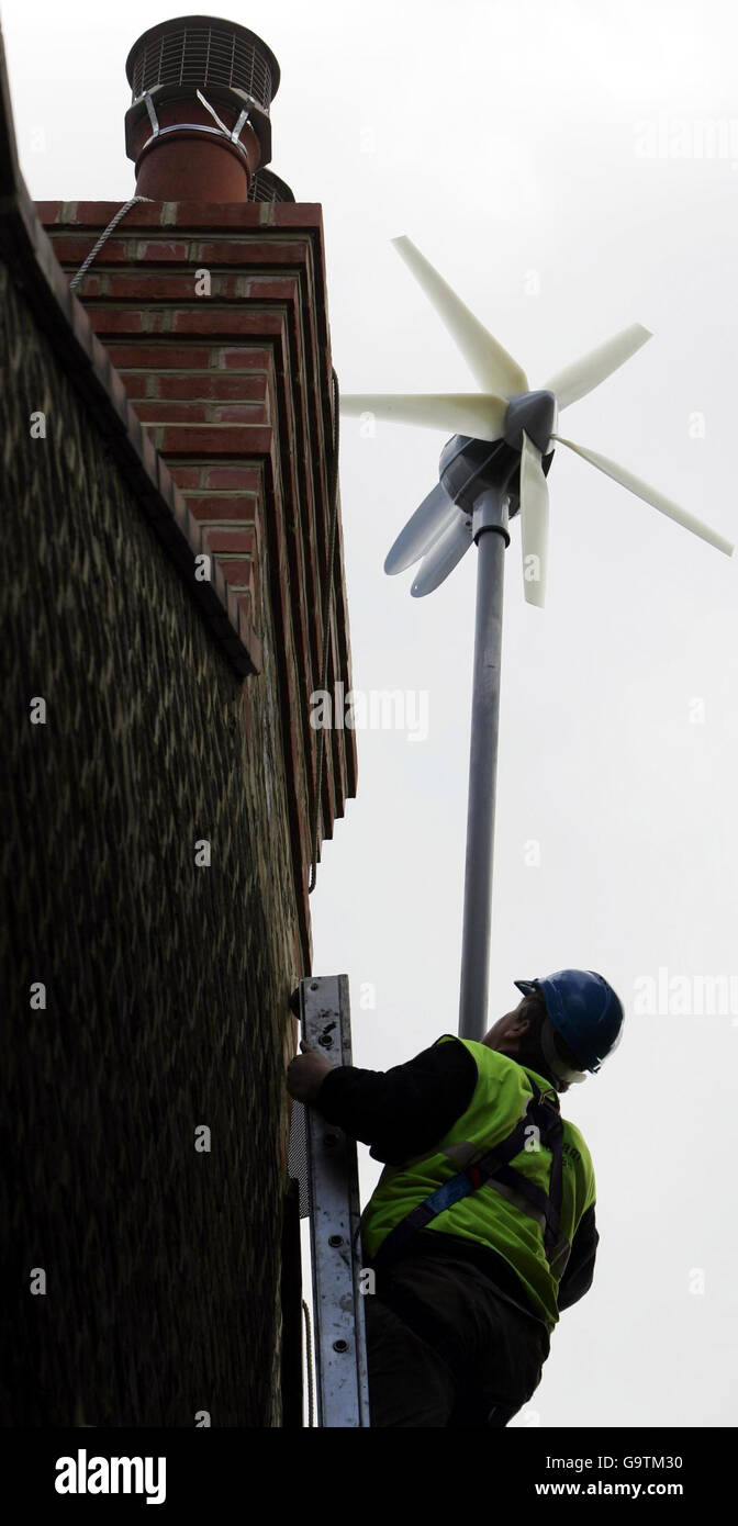 A workman errects the new wind turbine on Conservative Leader David ...