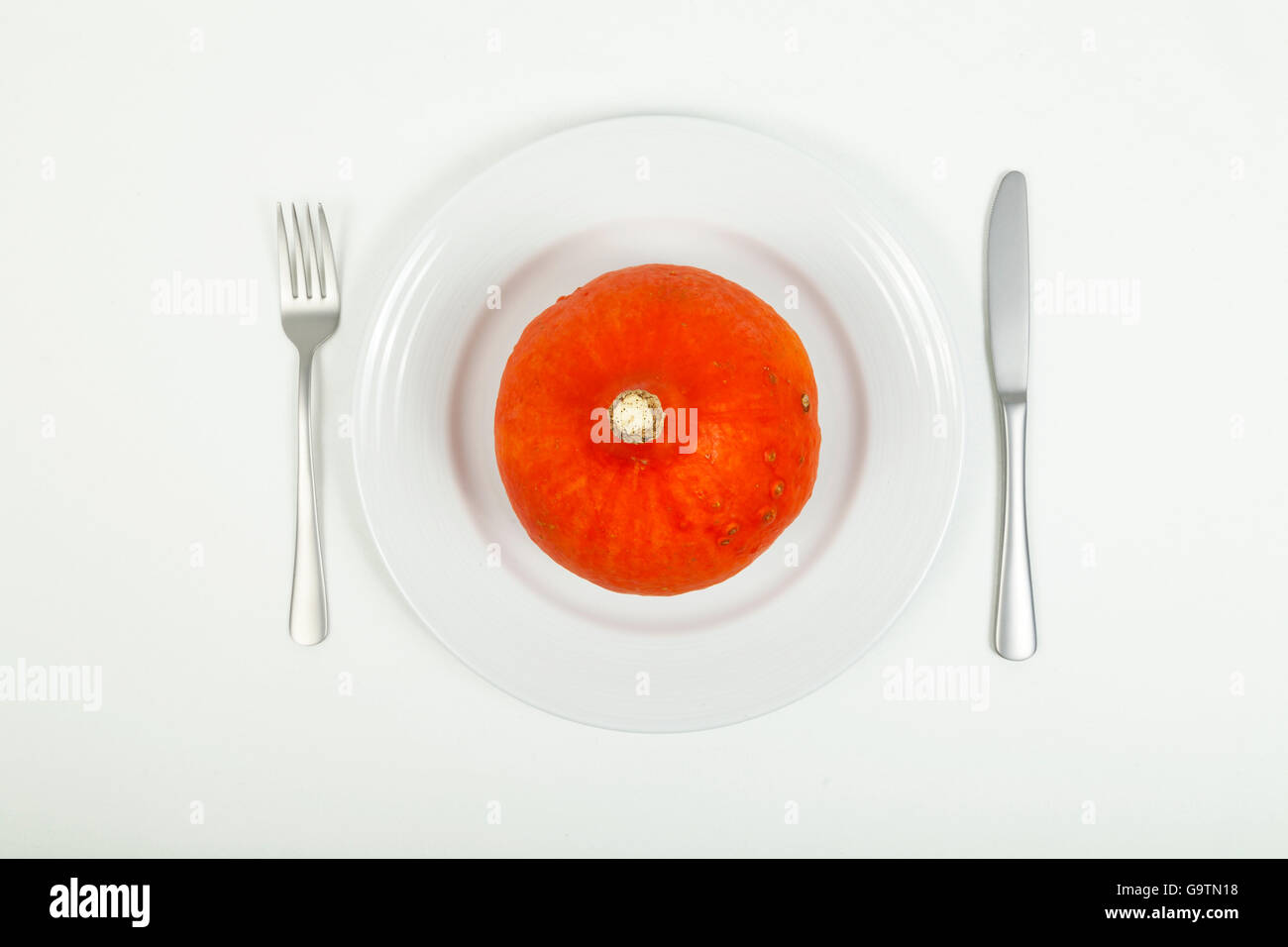 Orange calabash on plate Stock Photo - Alamy