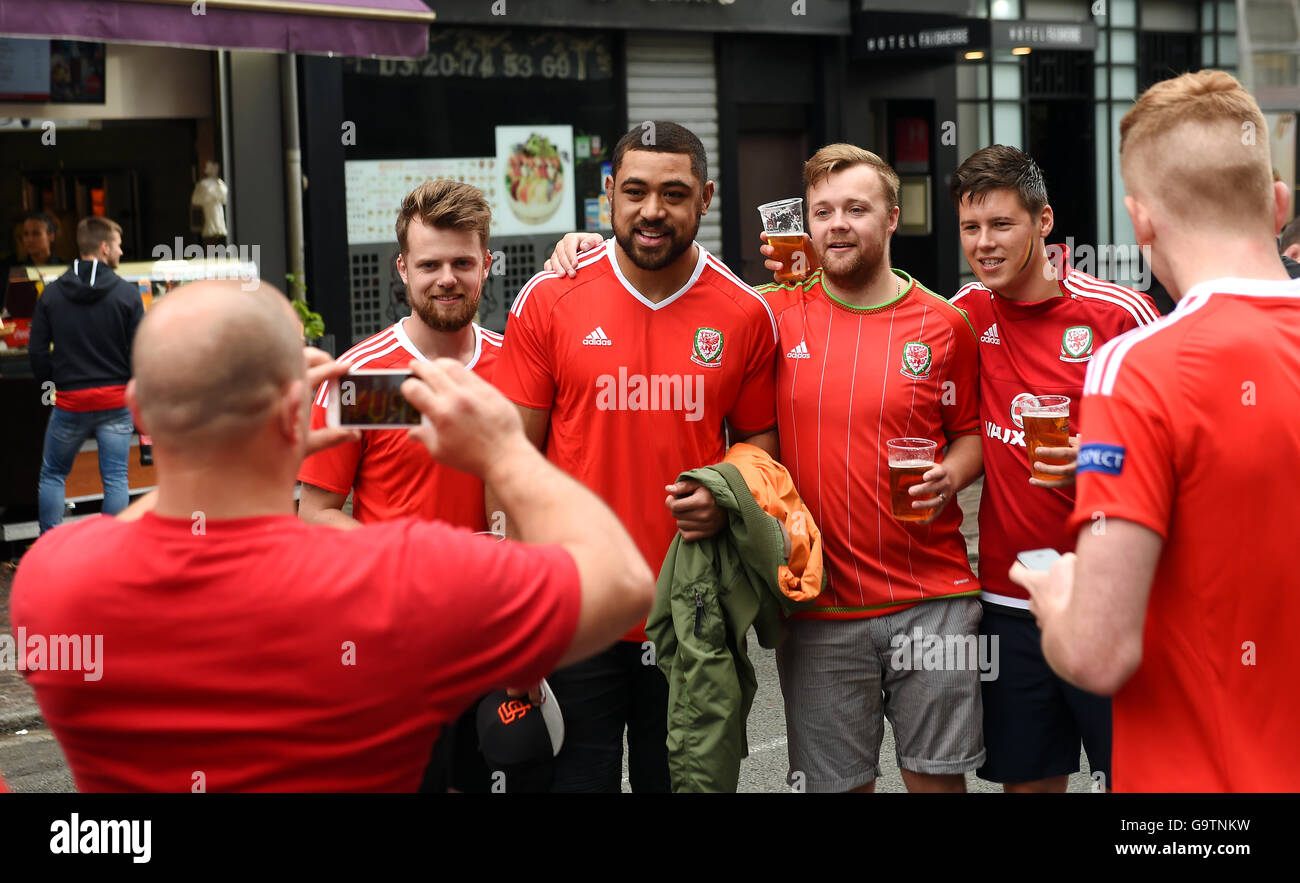 Wales International rugby player Taulupe Faletau (centre) poses for a ...
