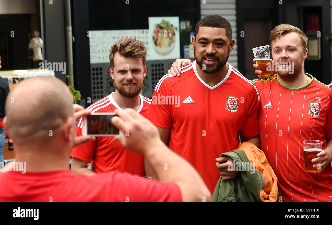 Wales International rugby player Taulupe Faletau (centre) poses for a ...