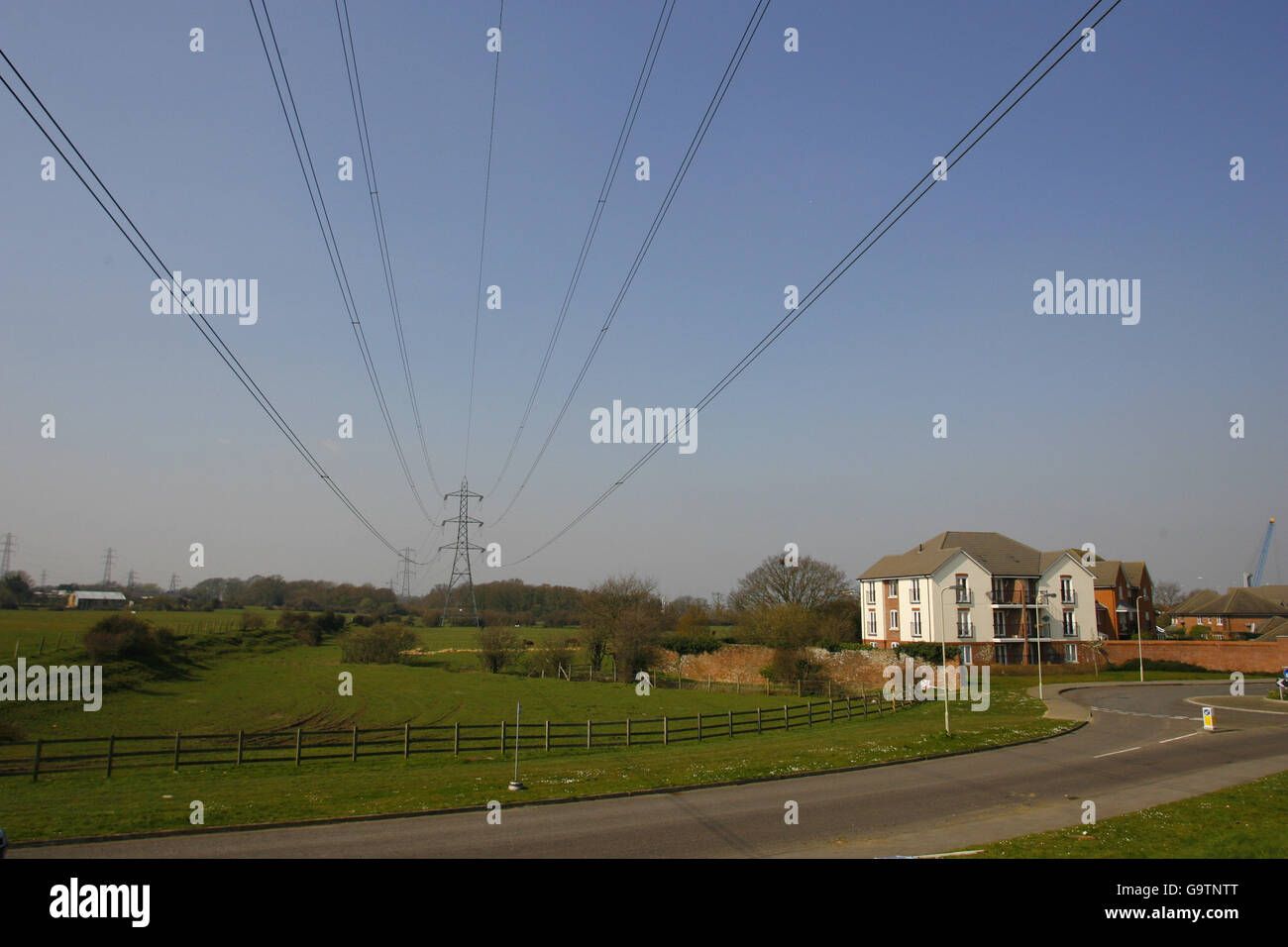 High tension power lines passover homes as they stretch across the ...