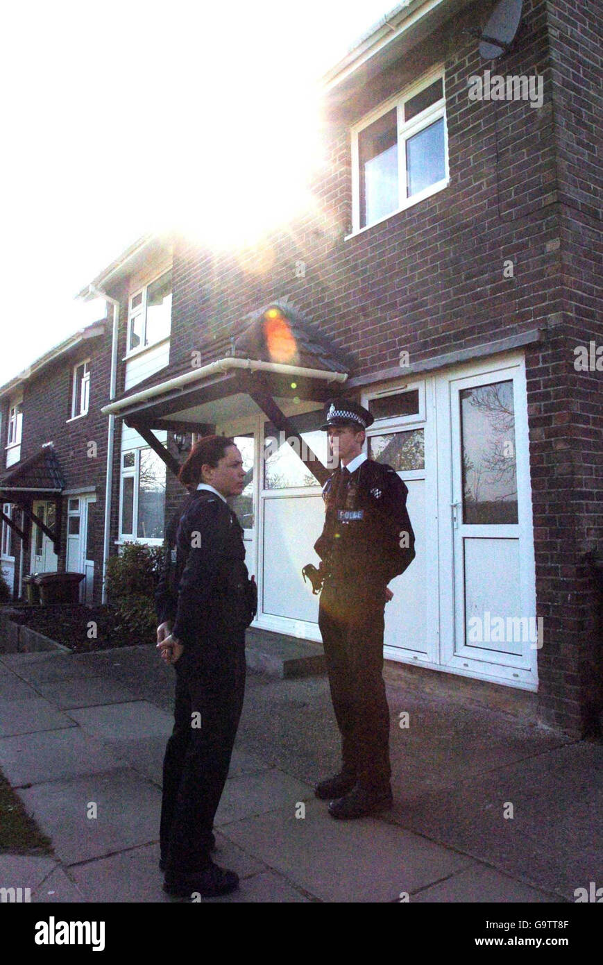 Police officers stand outside the home of Faye Turney in Tamerton ...