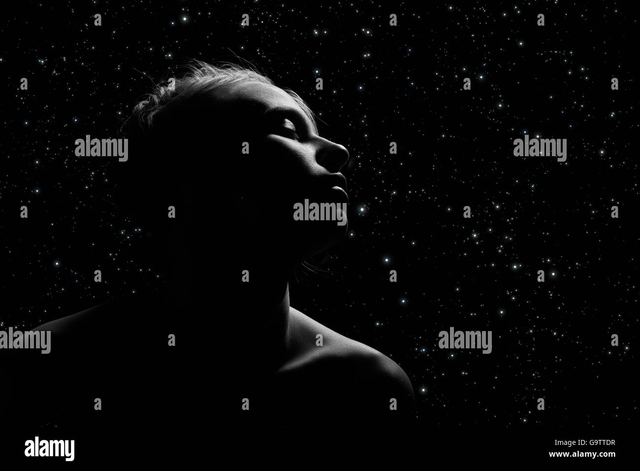 female profile on stars sky background monochrome image with copyspace ...