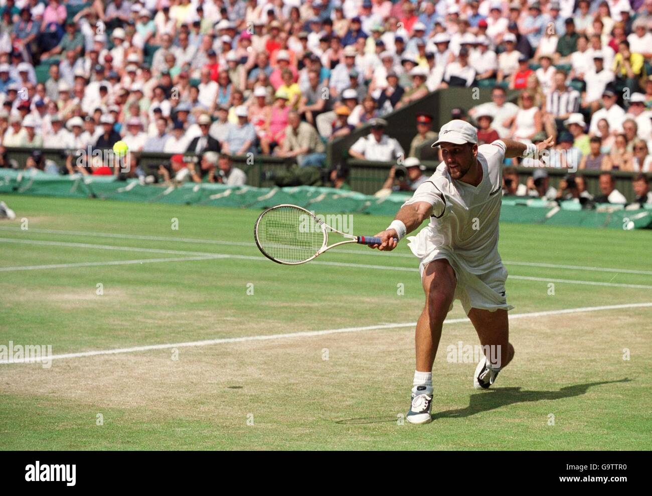 Australia's Pat Rafter makes a backhand return in his semi final ...
