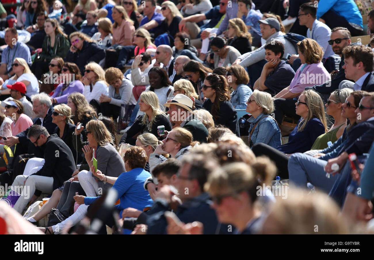 Spectators watch tennis on the big screen on Murray Mound on day five ...