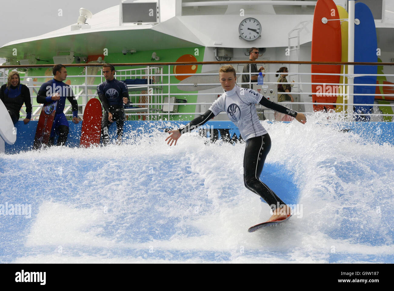 Staff try out the Flowrider surf simulator aboard the Liberty of the ...
