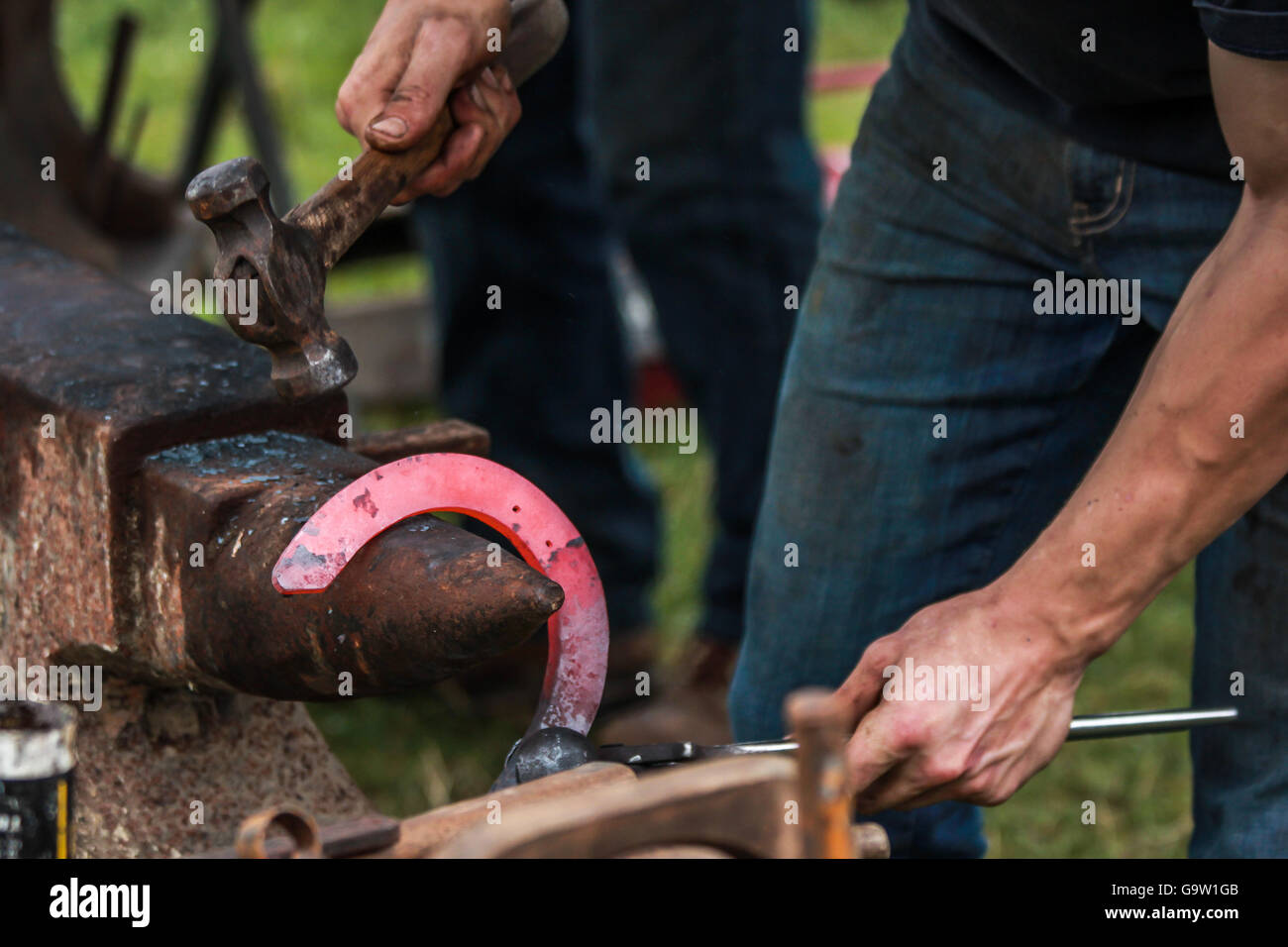 Blacksmith working very hard Stock Photo - Alamy