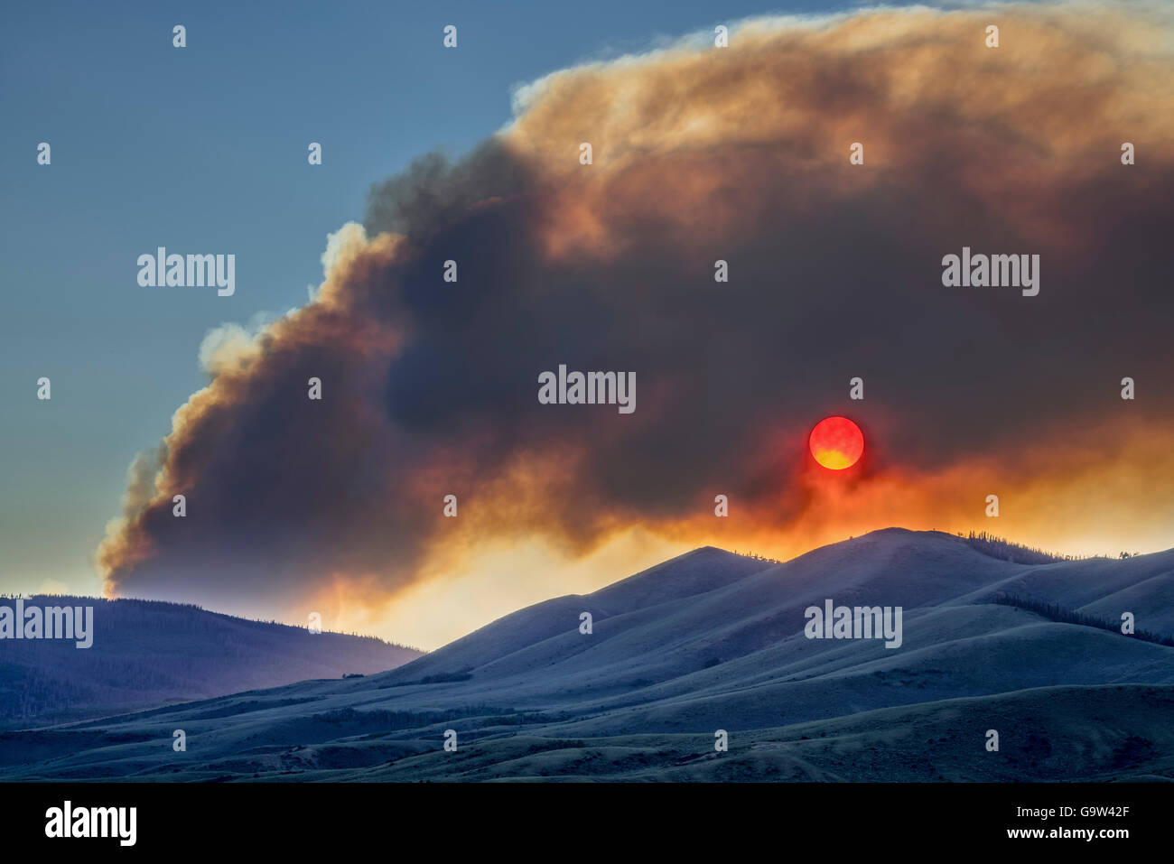 wildfire smoke plume obscuring sunset over mountains - North Park ...