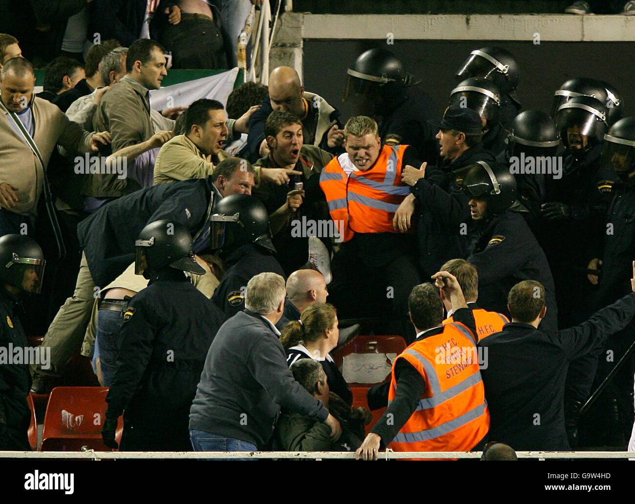 Tottenham hotspur fans and police clash in the stands hi-res stock ...