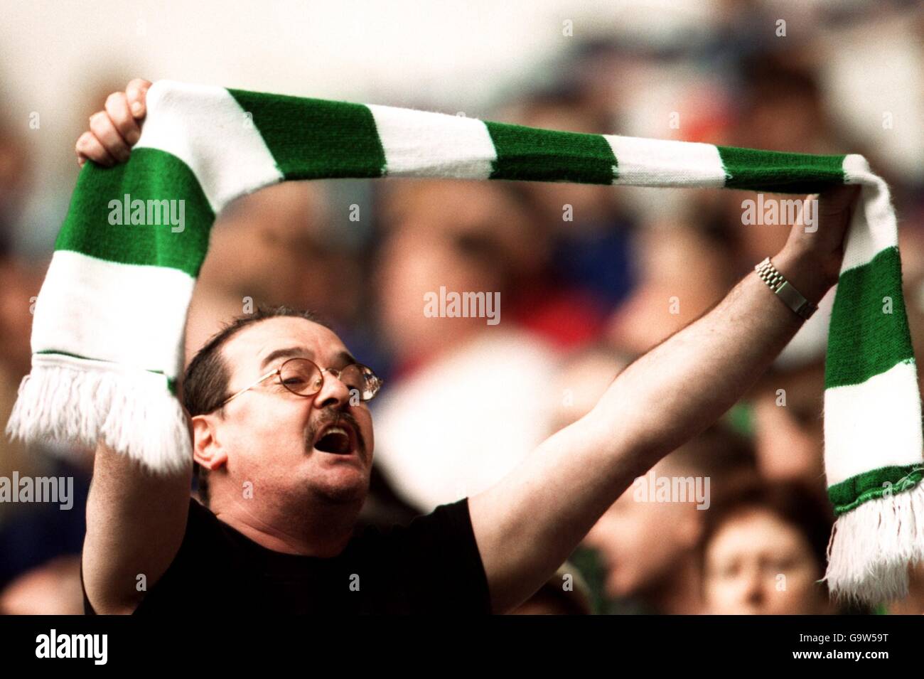 A hibernian fan cheers on his team hi-res stock photography and images ...