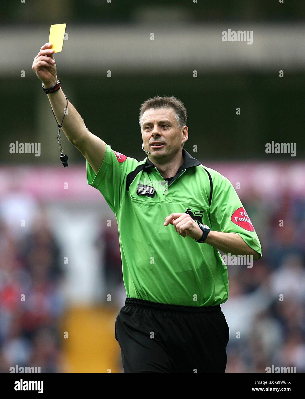 Referee mark halsey shows a yellow card hi-res stock photography and ...