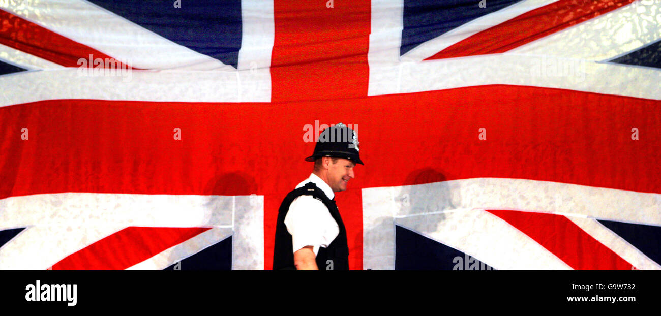 Police Stock. A policeman in front of a Union Jack flag Stock Photo - Alamy