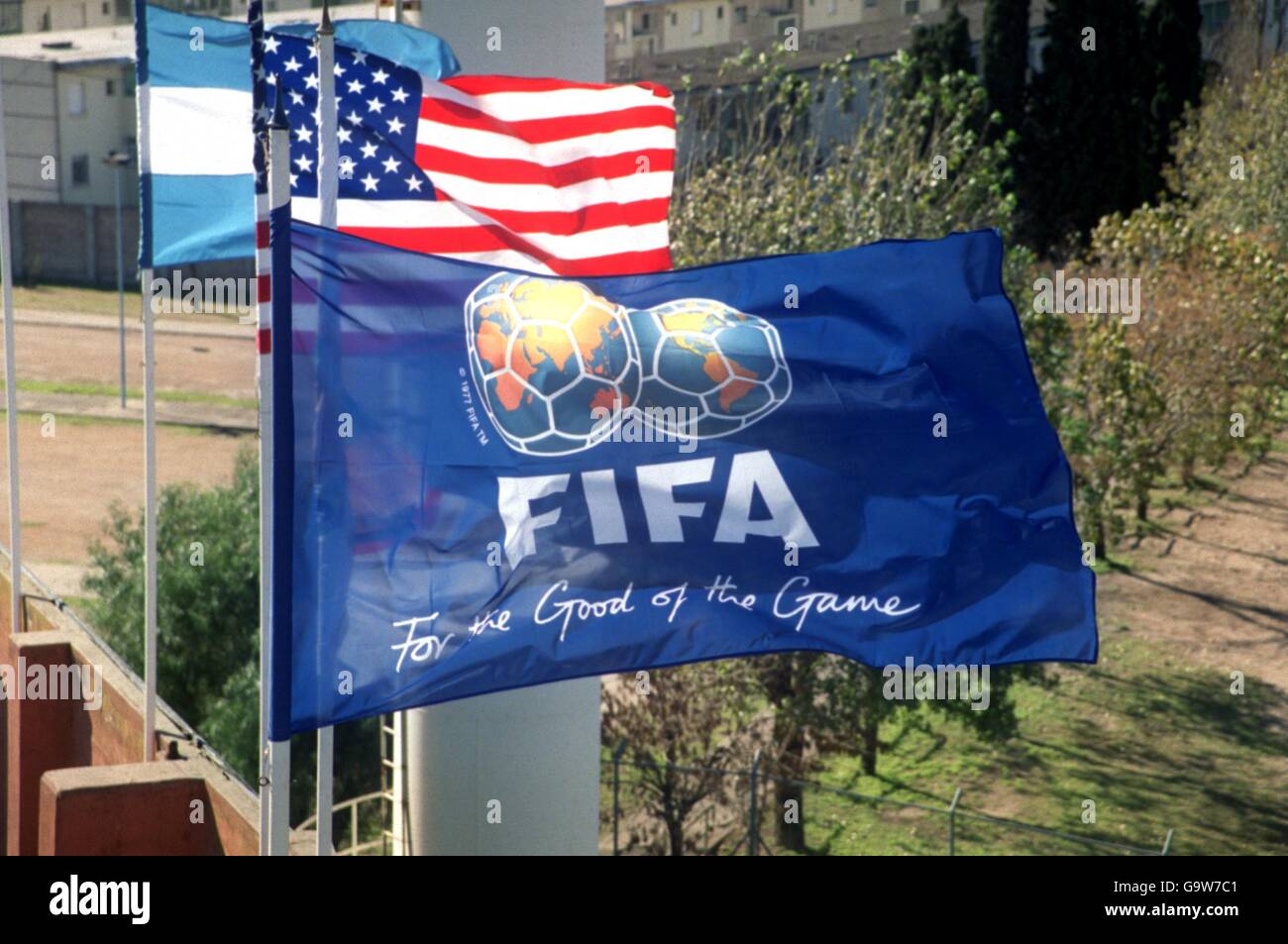 The FIFA flag flies alongside the national flags of the USA and ...