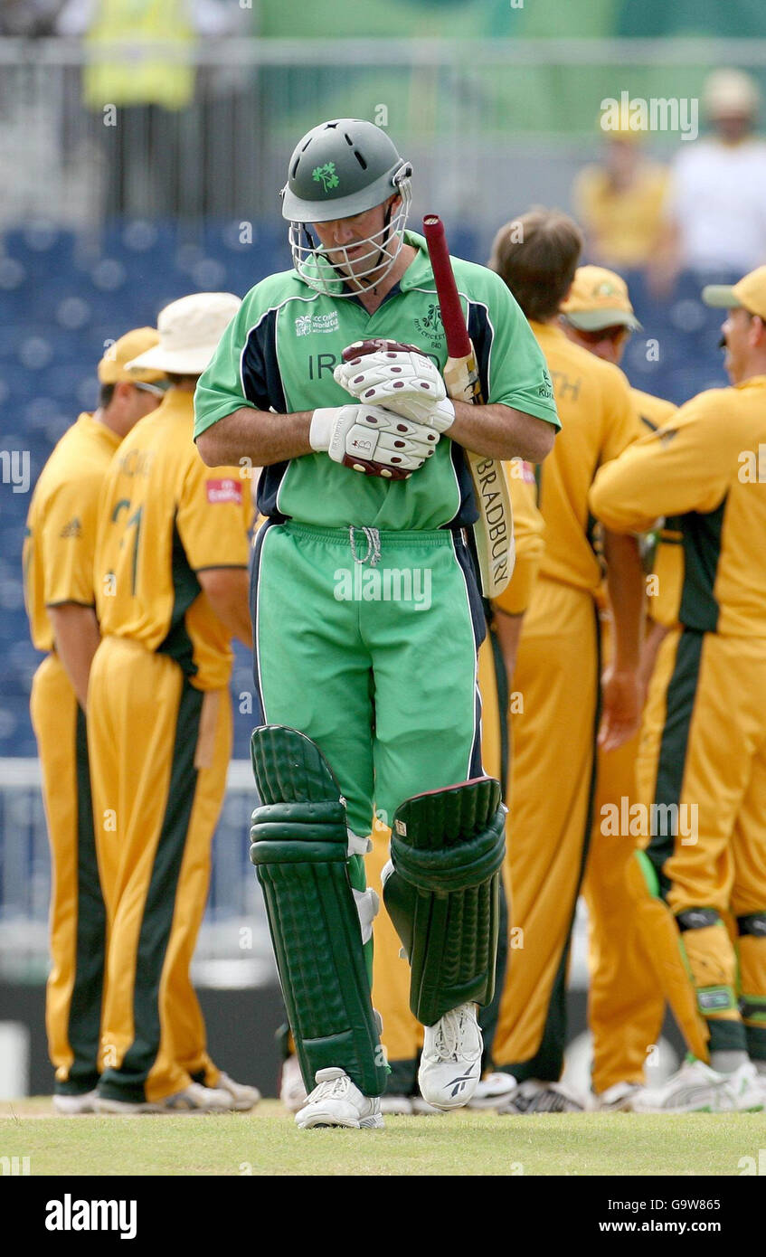 Ireland's Jeremy Bray leaves the field after losing his wicket to ...